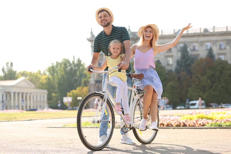 Happy Family with Bicycle Outdoors Stock Photo - Image of happy ...