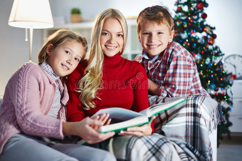 Happy family with book stock image. Image of holiday - 63777501