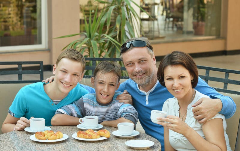 Happy family at breakfast stock image. Image of father - 53874143