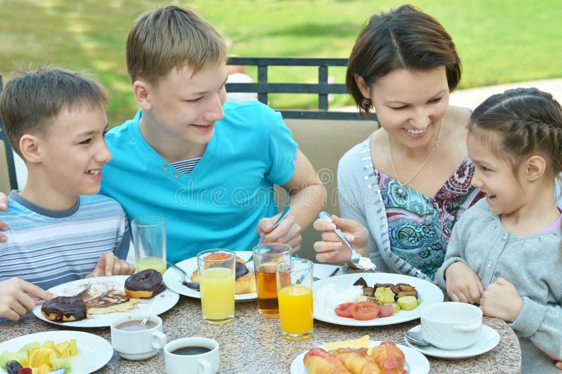 Happy family at breakfast stock photo. Image of people - 53874266