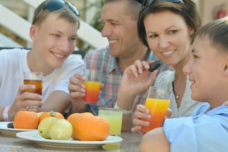 Happy family at breakfast stock image. Image of cafe - 66722037