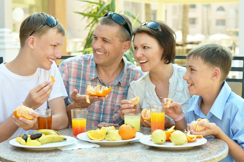 Happy family at breakfast stock image. Image of drink - 67427313