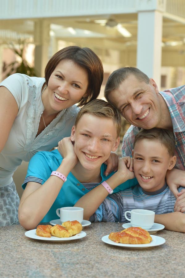Happy family at breakfast stock image. Image of attractive - 76739215