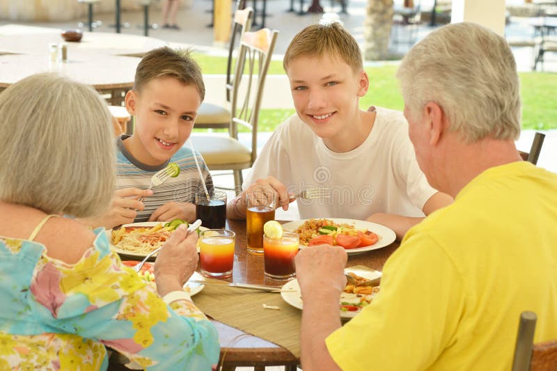 Happy family at breakfast stock photo. Image of children - 55379462