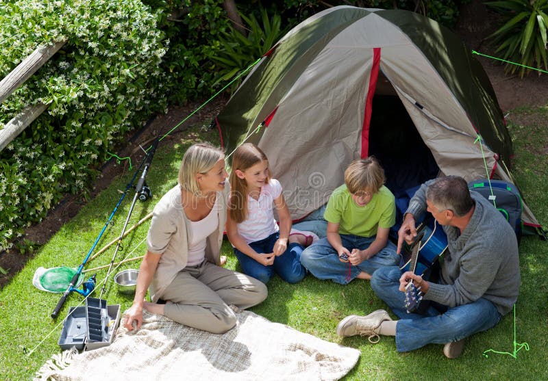 Family camping in tent stock image. Image of activity - 6808781