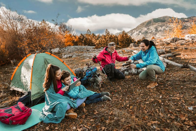 Family on a Camping Trip. Family Doing Camping in the Forest Stock ...