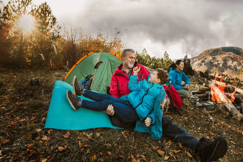 Family on a Camping Trip. Family Doing Camping in the Forest Stock ...