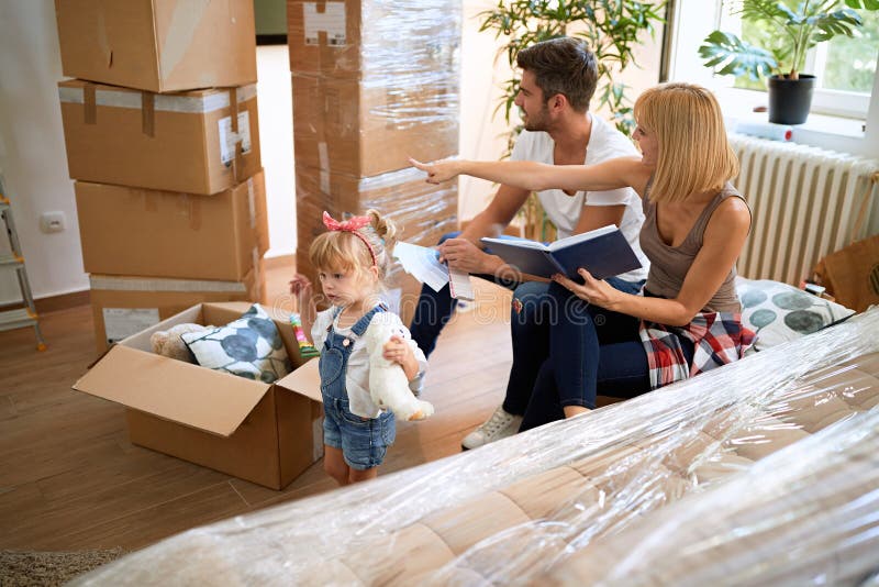 Family with Cardboard Boxes in New Home Stock Image - Image of child ...