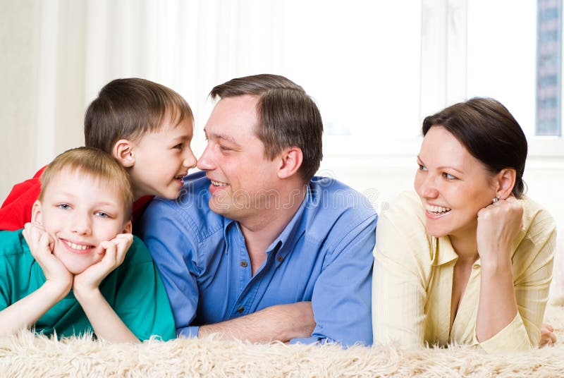 Happy family on the carpet stock image. Image of female - 14165243