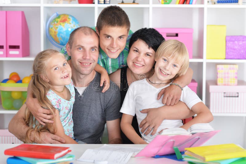 Happy family in classroom stock image. Image of color - 96883877