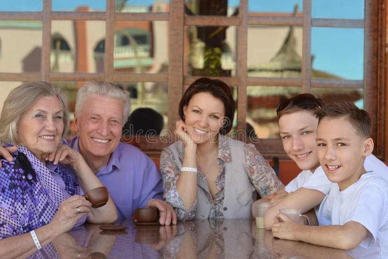 Happy family with coffee stock photo. Image of rest, sunny - 65604602