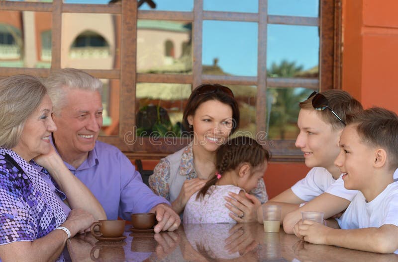 Happy family with coffee stock photo. Image of children - 72442488