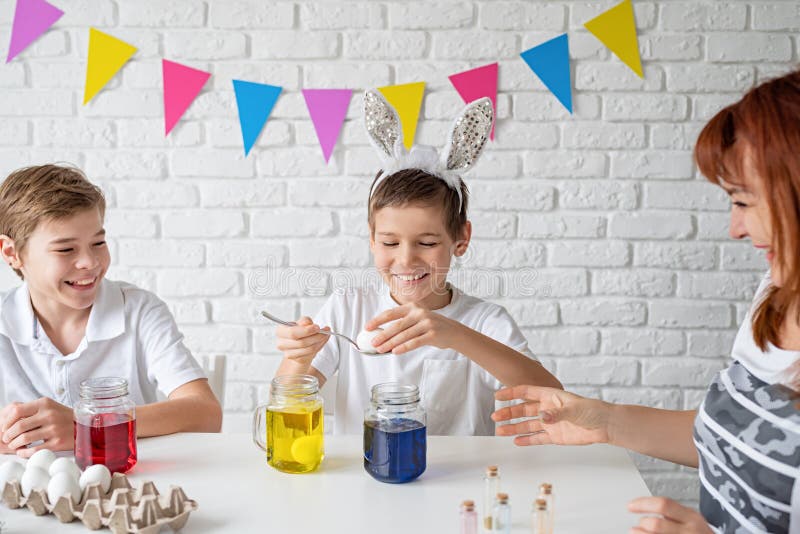 Happy Family Coloring Easter Eggs at Home Stock Image - Image of ...