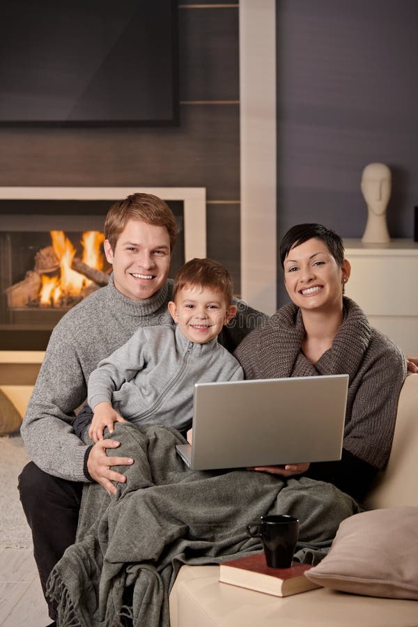 Happy family with computer stock image. Image of cute - 22664957