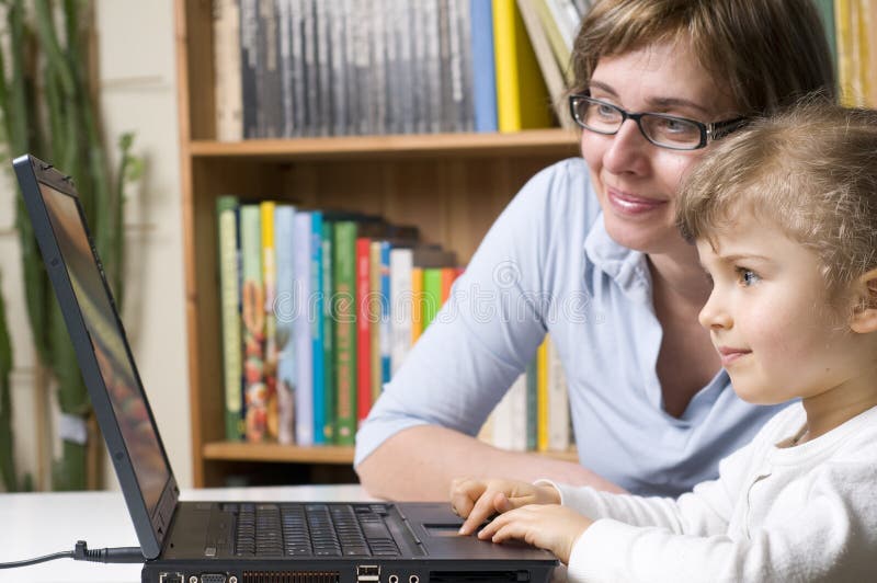 Happy family at computer stock photo. Image of playful - 4816774