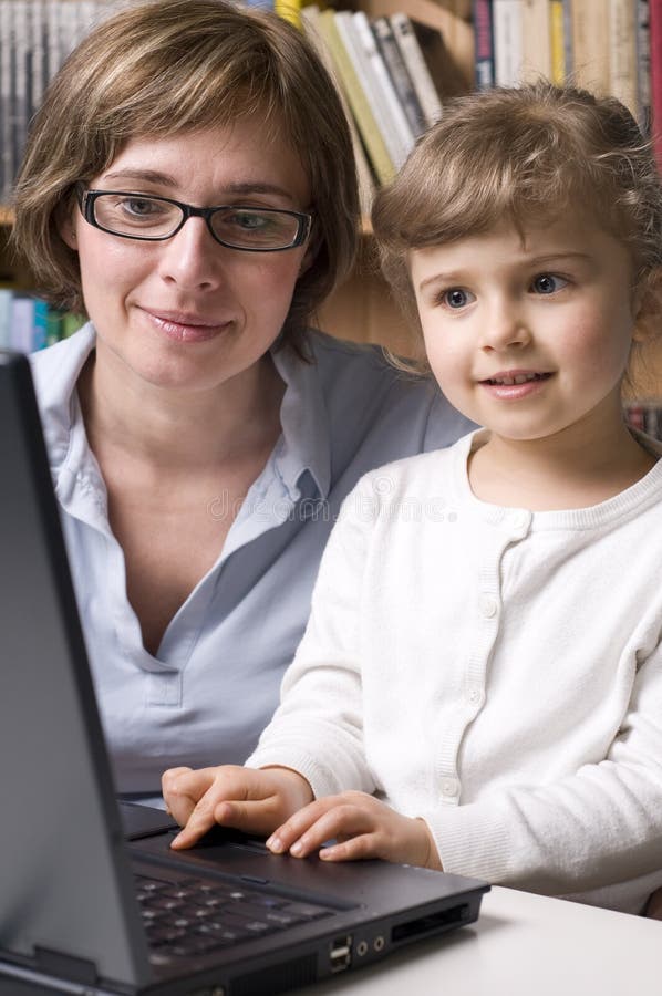 Happy family at computer stock image. Image of education - 4816781