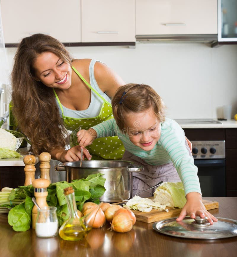 Happy family cooking soup stock image. Image of nutrition - 46814993
