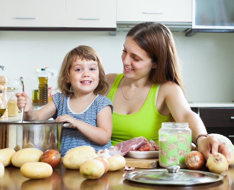 Happy family cooking soup stock image. Image of ribs - 42494869