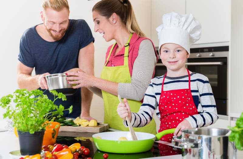 Family Cooking Together in Kitchen Stock Image - Image of eating ...
