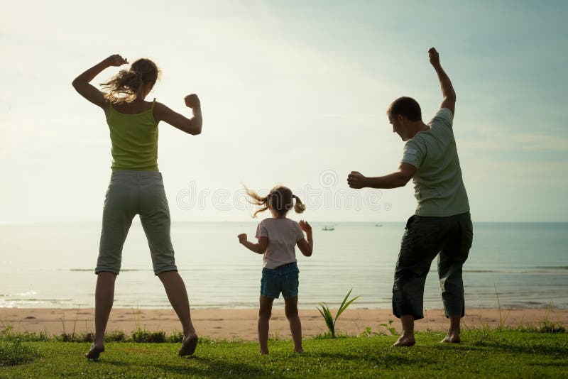 Happy Family Dancing the Beach Stock Image - Image of father, active ...
