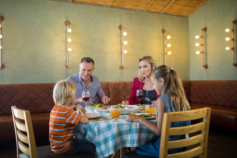 Happy Family Dining at Restauranrt Stock Photo - Image of drinking ...