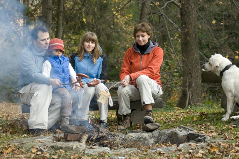 Happy Family with Dog Near Campfire Stock Image - Image of outdoors ...