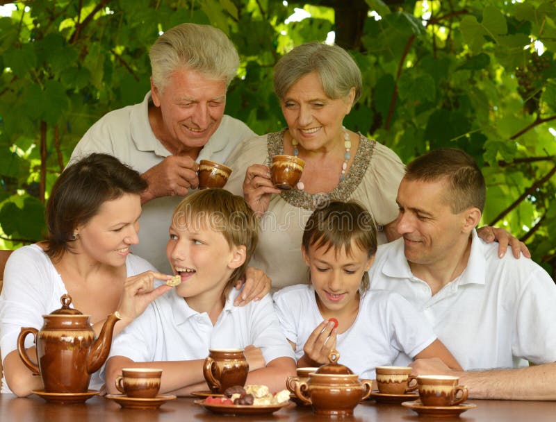 Happy family drinking tea stock photo. Image of happy - 40364084