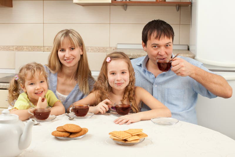 Happy family drinks tea stock photo. Image of caucasian - 21073870
