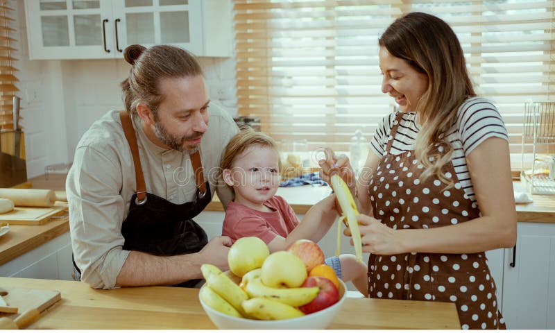 Happy Family Eating Fruits in the Kitchen Stock Photo - Image of ...