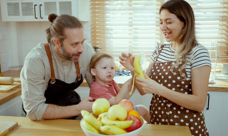 Happy Family Eating Fruits in the Kitchen Stock Image - Image of food ...