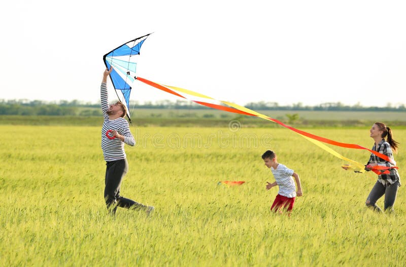 Happy Family Flying Kite in the Field Stock Image - Image of happy ...