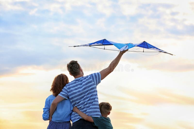 Happy Family Flying Kite Outdoors Stock Image - Image of caucasian ...