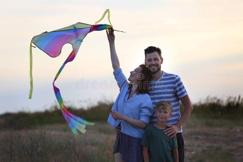 Happy Family Flying Kite Outdoors Stock Image - Image of kite, evening ...