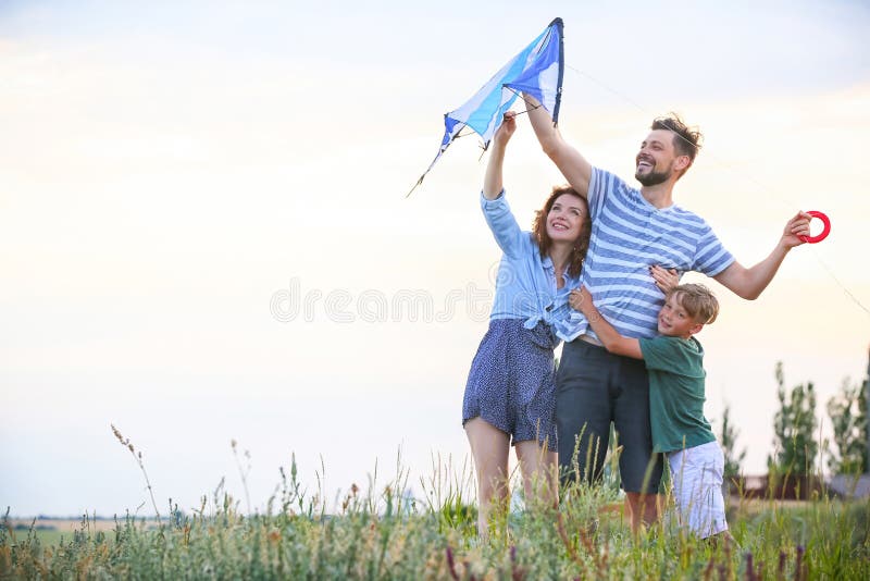 Happy Family Flying Kite Outdoors Stock Image - Image of enjoy, meadow ...