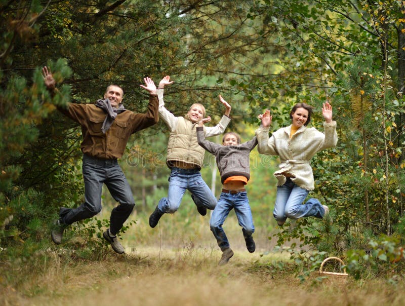 Happy Family in forest stock image. Image of fall, family - 47429043