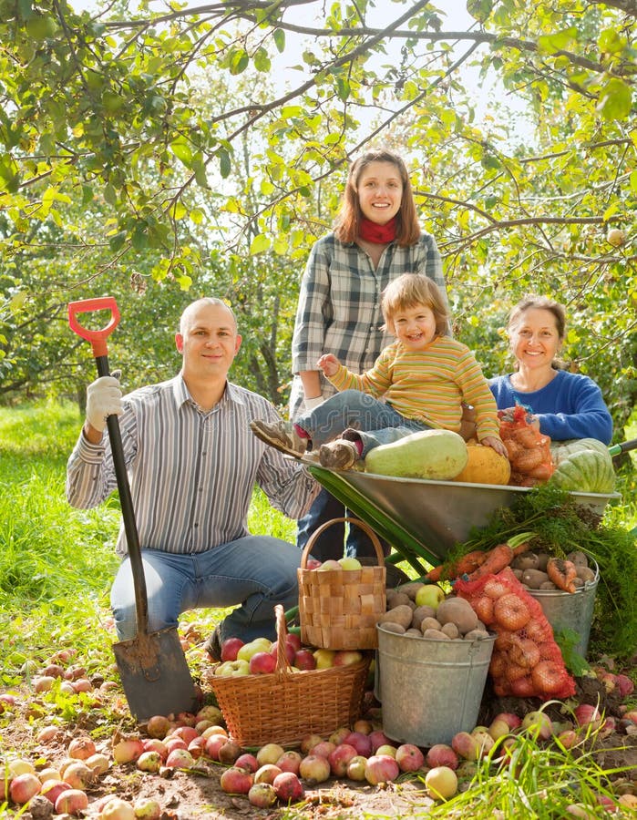 Happy family in garden stock photo. Image of happiness - 26972708