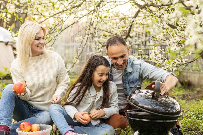 Happy Family Having Barbecue with Modern Grill Outdoors Stock Image ...