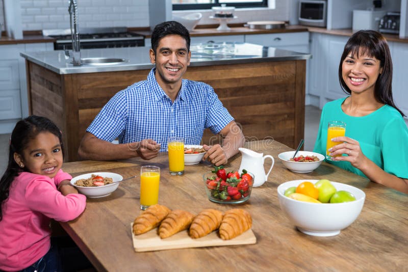 Happy Family Having Breakfast Stock Photo - Image of family, breakfast ...