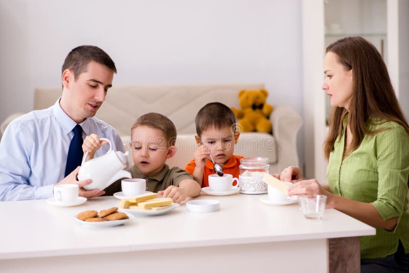 The Happy Family Having Breakfast Together at Home Stock Image - Image ...