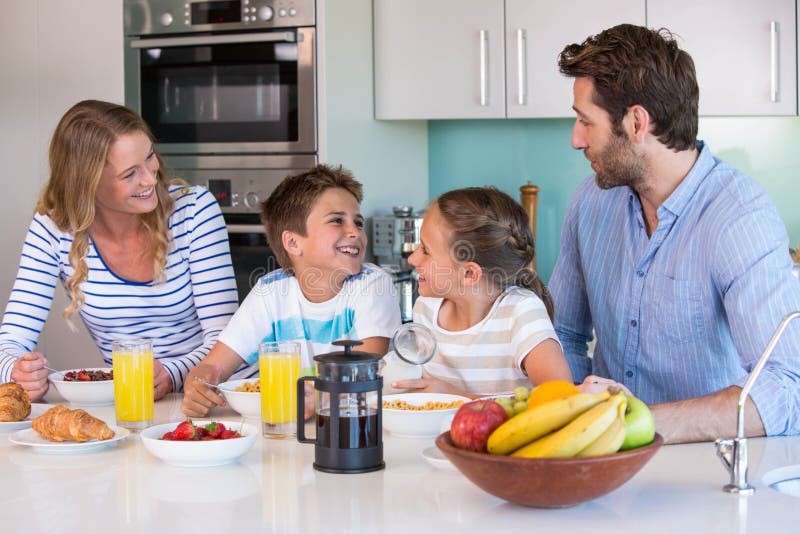 Happy Family Having Breakfast Together Stock Image - Image of clothing ...