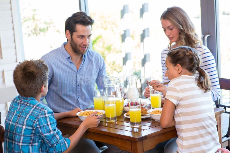 Happy Family Having Breakfast Together Stock Photo - Image of indoors ...