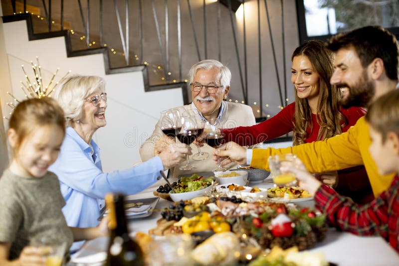 Happy Family Having Dinner with Red Wine at Home Stock Photo - Image of ...
