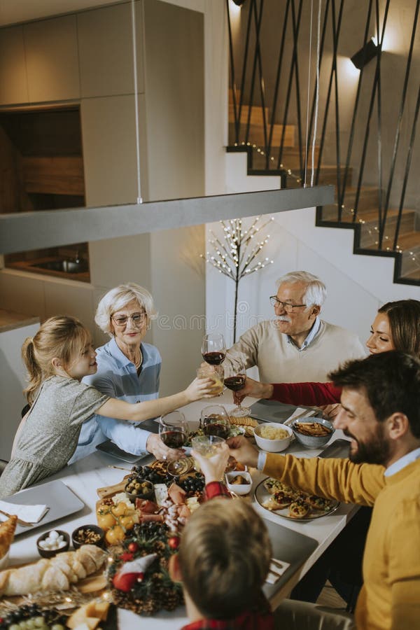Happy Family Having Dinner with Red Wine at Home Stock Photo - Image of ...
