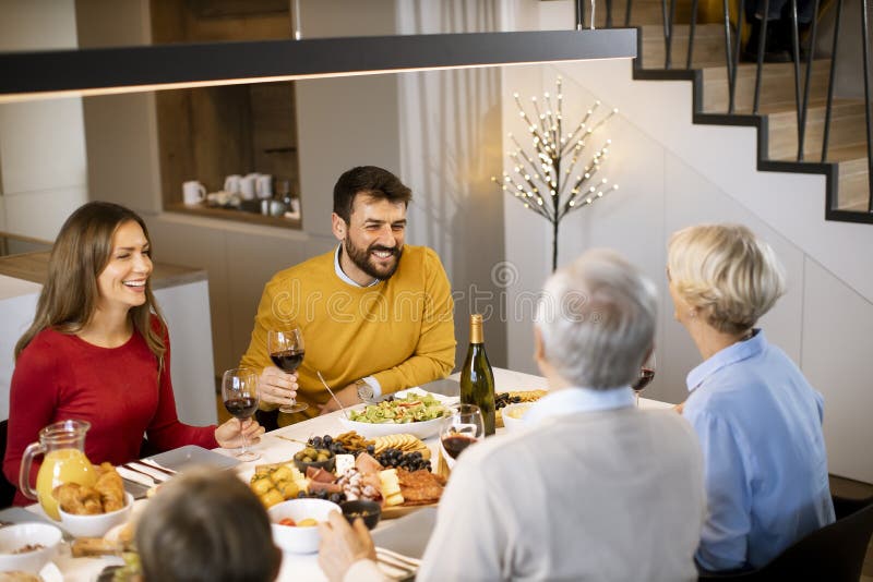 Happy Family Having Dinner with Red Wine at Home Stock Image - Image of ...