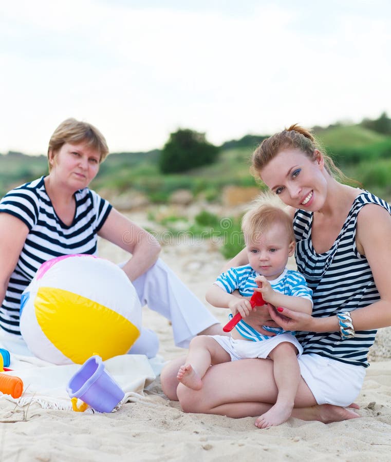 Happy Family Having Fun at the Beach Stock Image - Image of hands ...