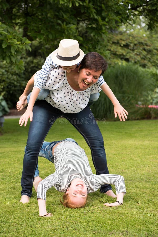Happy Family Having Fun in the Garden Stock Image - Image of sister ...