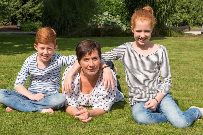 Happy Family Having Fun in the Garden Stock Photo - Image of children ...