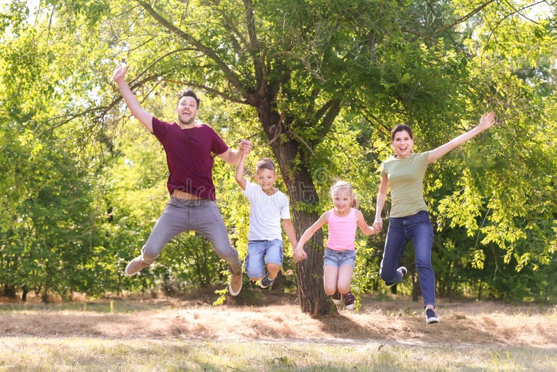 Happy Family Having Fun in Park Stock Photo - Image of daughter ...