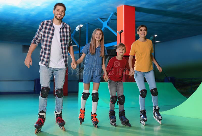 Family Having Fun at Roller Skating Rink Stock Photo - Image of girl ...
