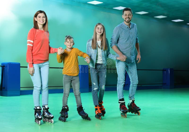 Family Having Fun at Roller Skating Rink Stock Image - Image of center ...